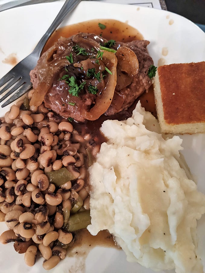 Southern comfort on a plate—chopped steak, black-eyed peas, and mashed potatoes. This isn't a meal; it's a warm hug from Georgia.