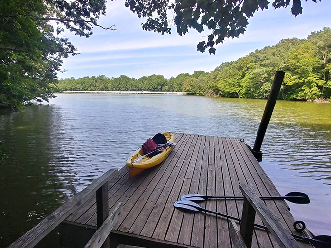 A wooden dock stretching into possibility—just add kayak and subtract your everyday worries.