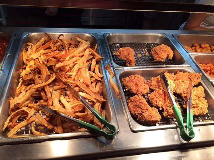 The buffet line's greatest hits album – crispy fries and perfectly fried chicken waiting to make your diet plans tomorrow's problem.