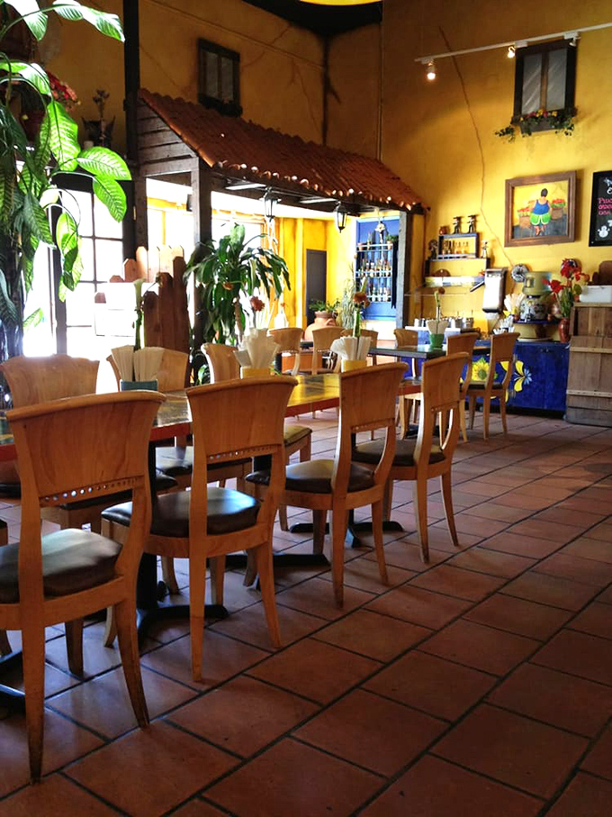 Plants, natural light, and cheerful yellow walls create the perfect backdrop for the main event—food that makes you want to hug the chef.