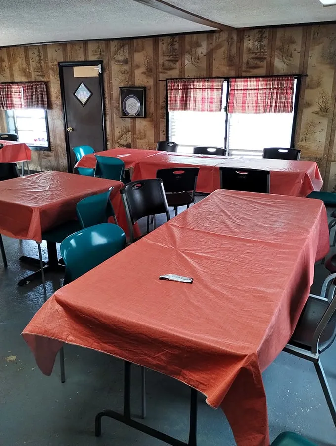 Orange tablecloths and mismatched chairs create the perfect setting for serious eating. No distractions from the main event: that glorious barbecue.