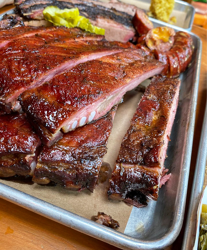 Ribs with bark so perfect they should be in a museum. That smoke ring is basically a halo—these ribs have achieved meat enlightenment.