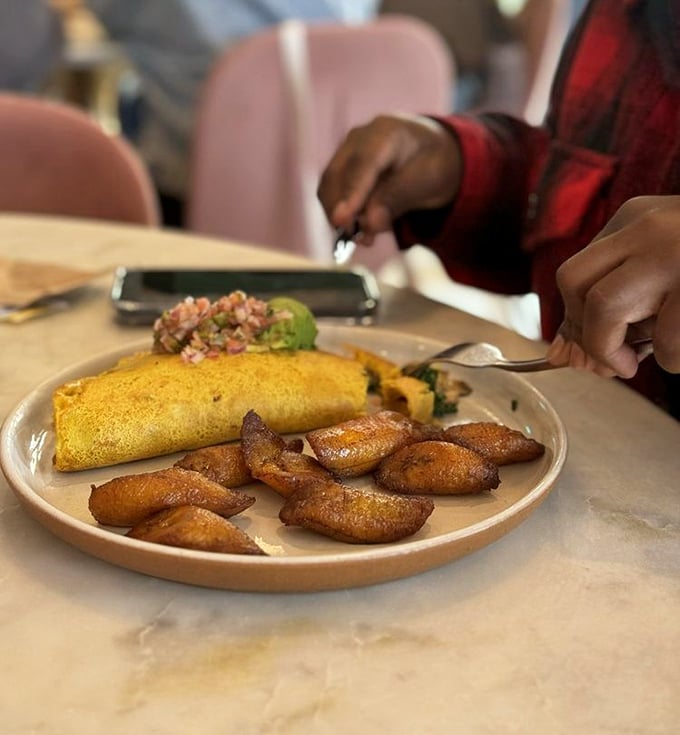 Not just an omelet but a golden sunrise on a plate, with sweet plantains standing by like delicious sentinels.