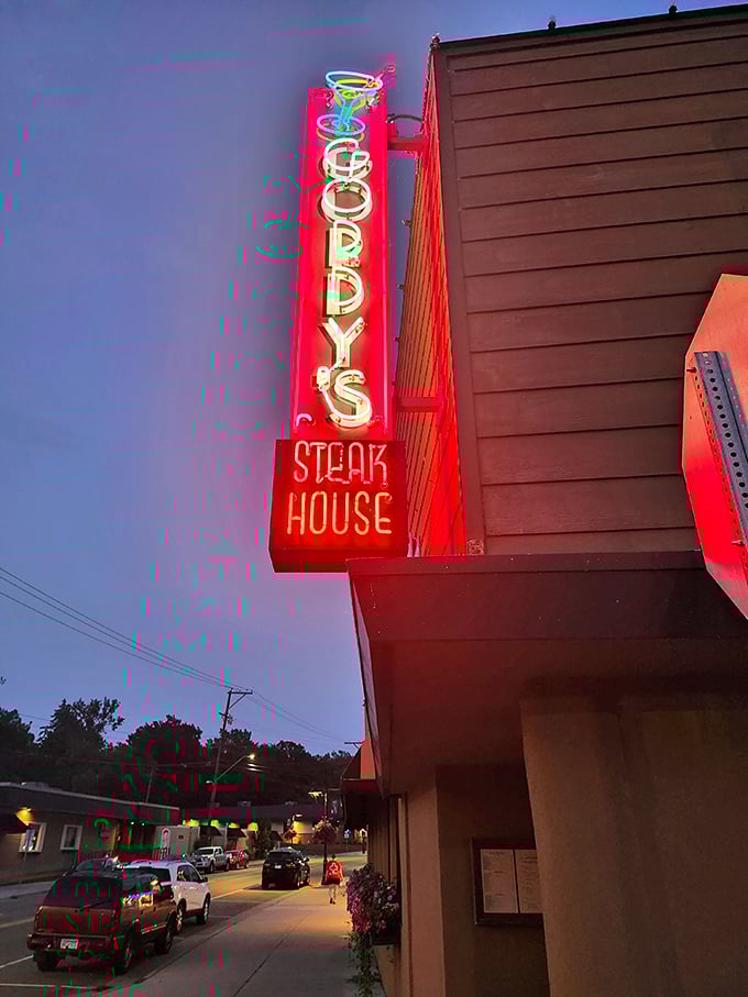 That glowing neon sign cuts through Minnesota darkness like a hot knife through butter – or a steak knife through prime beef.