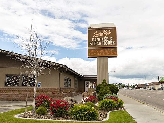 Smitty's sign promises two essential food groups: pancakes and steaks. The lush landscaping hints at the care taken inside.