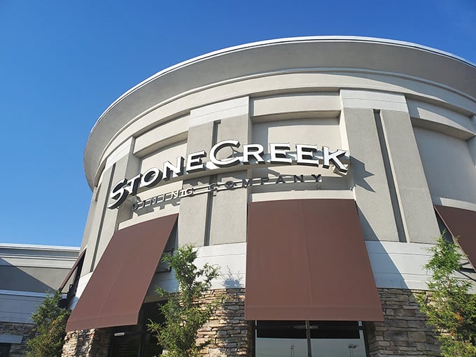 Stone Creek's curved entrance is like a welcoming hug from architecture, saying "Come in, the steaks are even more impressive than our building."