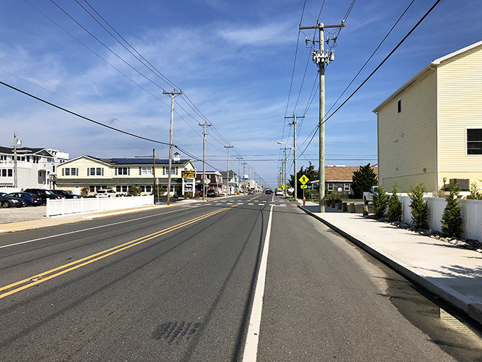 Where beach houses stand like friendly neighbors, sharing ocean breezes and the rhythm of island living.