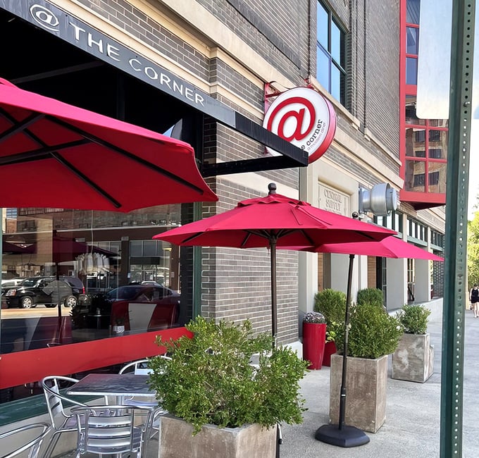 The line outside At The Corner tells you everything you need to know—this place is worth the wait. Those red umbrellas aren't just for show; they're beacons of breakfast bliss.