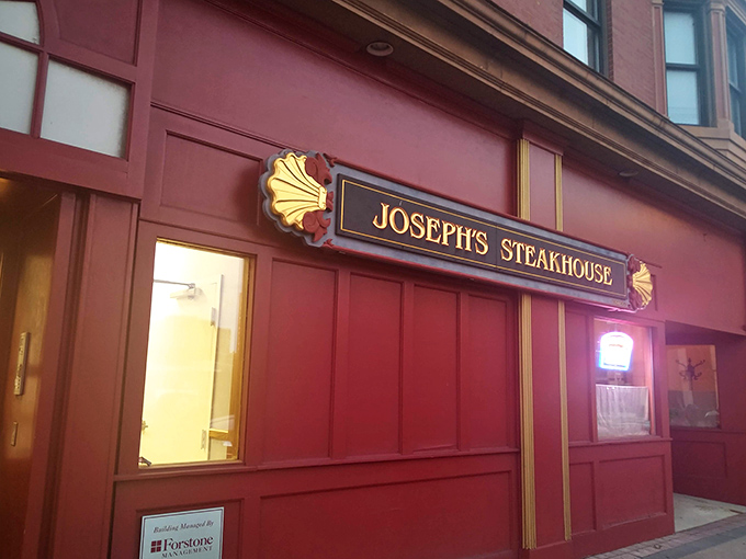 The unassuming brick façade of Joseph's Steakhouse hides culinary greatness like Clark Kent's glasses hide Superman. Classic signage promises old-school excellence.