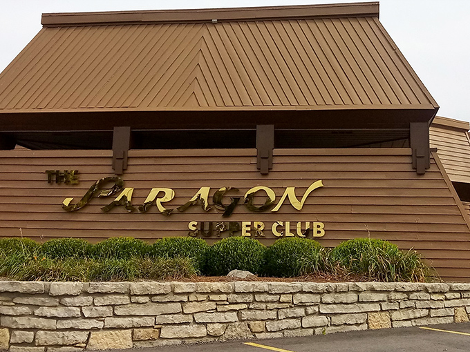 The unassuming exterior of The Paragon hides its treasures like a culinary speakeasy. This wooden façade in Dayton has witnessed decades of special occasions and Tuesday night splurges.