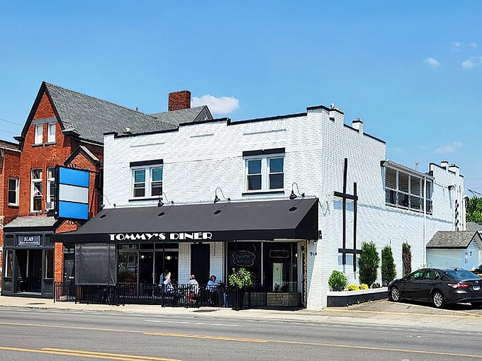 Tommy's Diner stands proudly on West Broad Street, its classic black awning and white brick exterior a beacon for comfort food pilgrims across Ohio.