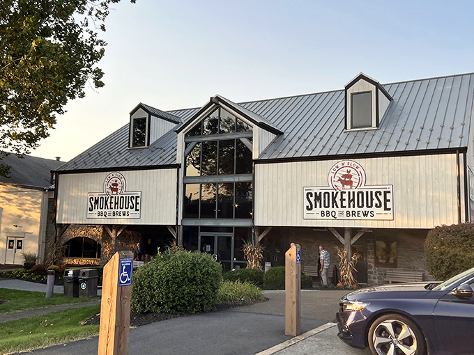 The rustic charm of Smokehouse BBQ & Brews beckons from the roadside like a siren song for meat lovers navigating the rolling hills of Amish Country.