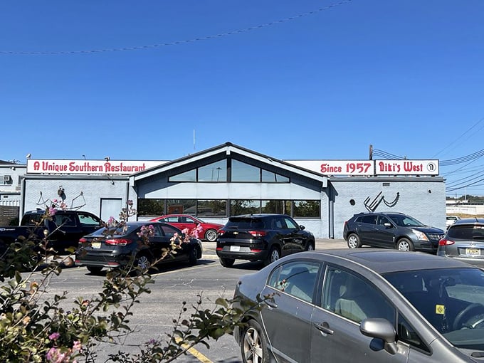 The unassuming exterior of Niki's West stands like a culinary lighthouse on Finley Avenue, beckoning hungry Alabamians with its "Unique Southern Restaurant" promise since 1957.