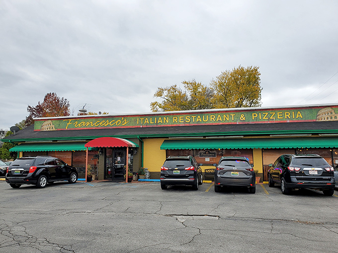 The cheerful yellow exterior with its red and green awnings isn't just inviting—it's practically shouting "authentic Italian food inside!" like a culinary town crier.