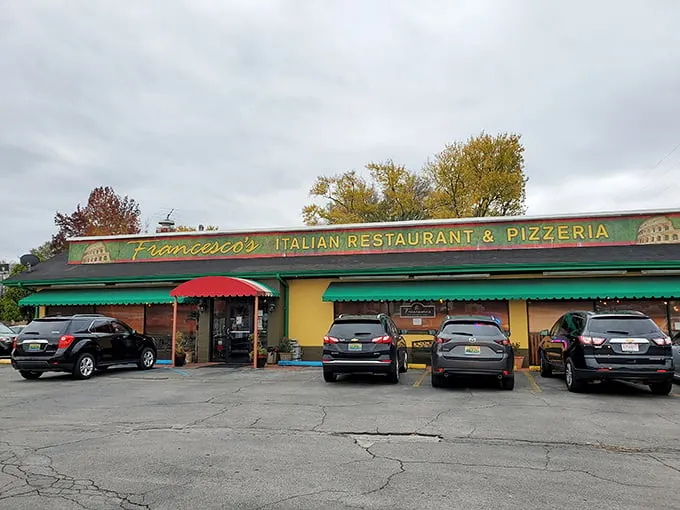 The cheerful yellow exterior with its red and green awnings isn't just inviting—it's practically shouting "authentic Italian food inside!" like a culinary town crier.