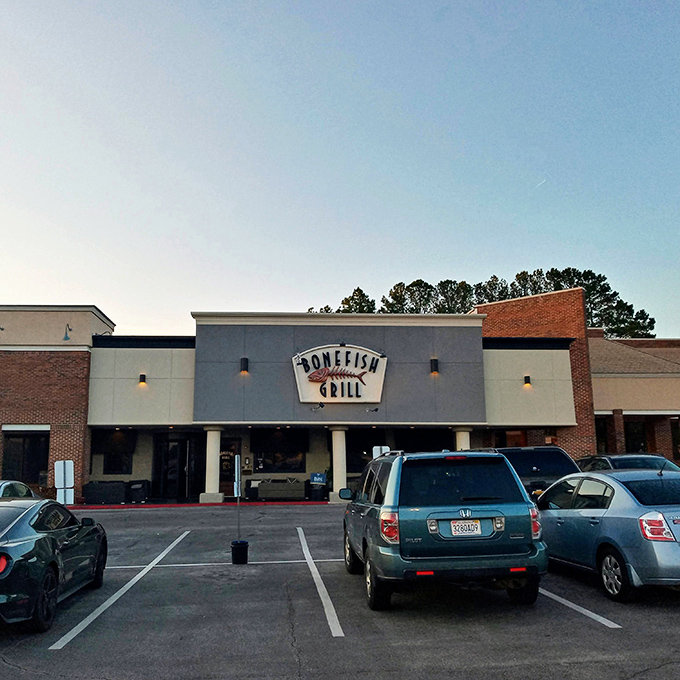 The iconic Bonefish Grill facade stands like a beacon for seafood lovers, its distinctive fish skeleton sign promising aquatic delights within.