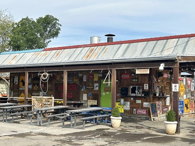 This isn't a movie set for a Western—it's lunch! Jalapeño Buck's tin-roofed charm promises smoky treasures within those weathered wooden walls.