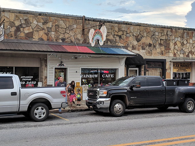 The rainbow sign beckons like a promise – this unassuming stone facade in Mountain View hides culinary treasures worth discovering.