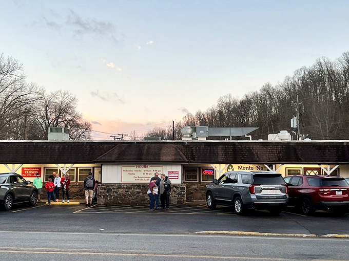 The unassuming exterior of Monte Ne Inn Chicken belies the culinary magic happening inside. Pilgrims of perfect poultry gather at dusk, drawn by decades of delicious reputation.