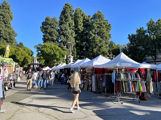 Rows of white tents under towering trees create LA's perfect Sunday morning – sunshine, shopping, and the sweet possibility of stumbling upon something extraordinary.