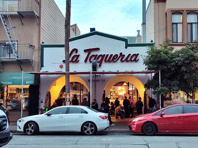 The iconic white facade with its distinctive red script beckons hungry pilgrims like a taco temple. Those arches aren't just decorative—they're gateways to burrito bliss.