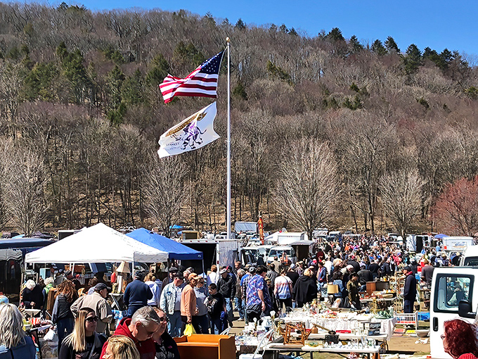 Treasure hunters navigate the bustling aisles on a perfect New England morning. The thrill of the hunt is palpable in the autumn air.