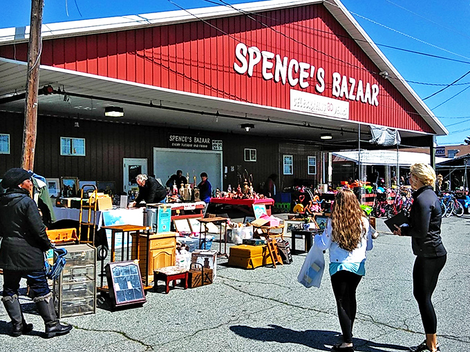 The iconic red barn of Spence's Bazaar stands like a beacon for treasure hunters—Delaware's very own retail Narnia behind those unassuming doors.