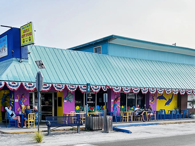 The turquoise beacon of breakfast bliss on Anna Maria Island beckons with its vibrant murals and promise of culinary treasures within.