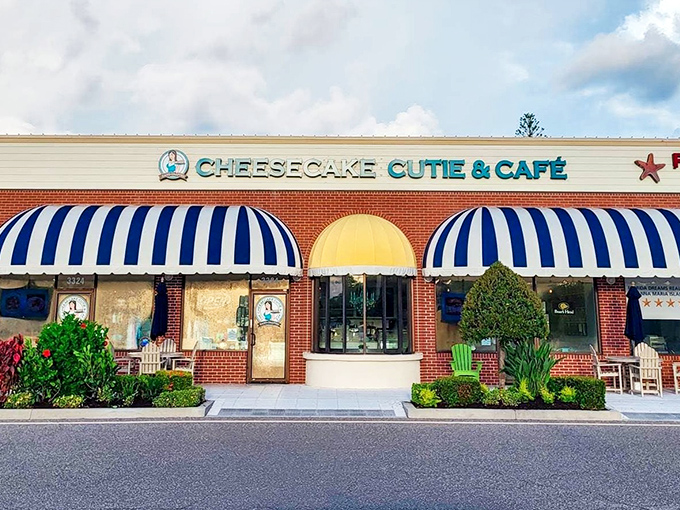 Those blue and yellow awnings aren't just for show—they're like a beacon guiding hungry travelers to cheesecake paradise on Anna Maria Island.