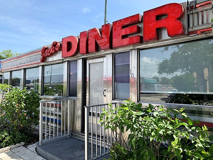 The classic diner silhouette against Florida's blue sky feels like a time machine with palm trees—nostalgic Americana meets tropical paradise.