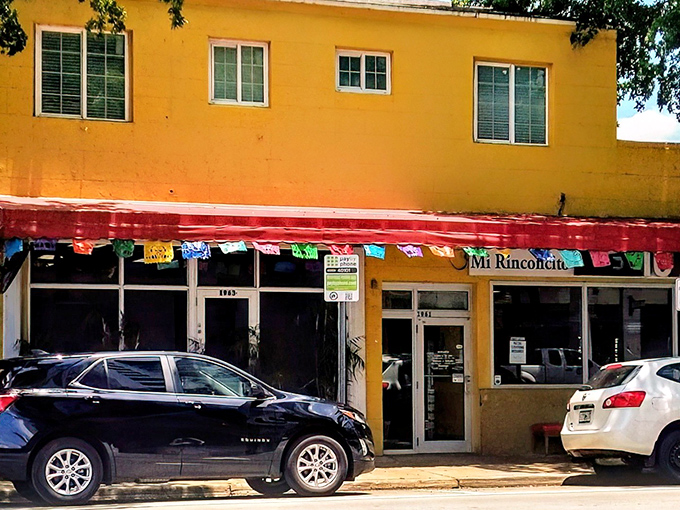 The sunshine-yellow exterior with its festive red awning isn't just a restaurant—it's a landmark for burrito pilgrims throughout Florida.