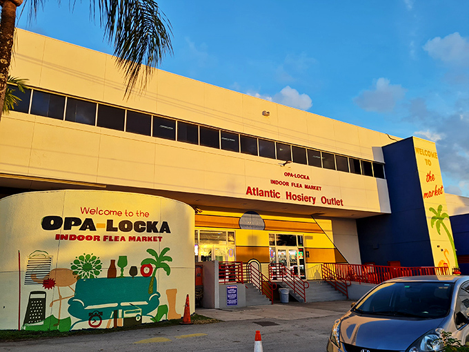 The sunshine-yellow façade of the Opa-locka Indoor Flea Market stands like a retail oasis, promising treasures within its no-frills exterior.