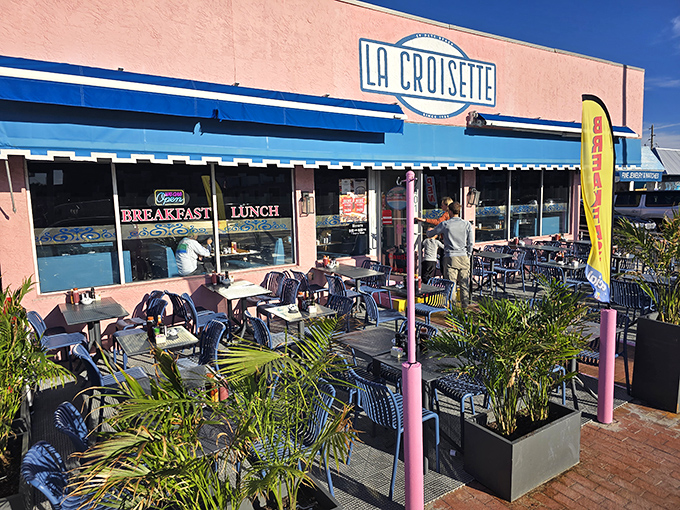 La Croisette's cheerful pink exterior with blue awnings stands out like a breakfast beacon on St. Pete Beach, promising French-inspired delights inside.