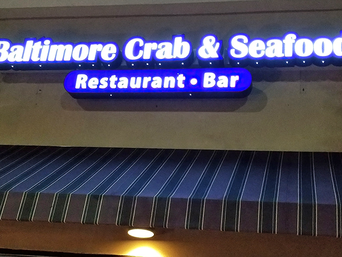 The blue neon sign beckons like a lighthouse for seafood lovers. Maryland magic awaits inside this Atlanta treasure.