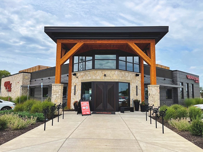 The stone and timber façade of Grindstone on the Monon stands like a welcoming beacon for hungry travelers. Rustic elegance meets Hoosier hospitality at first glance.