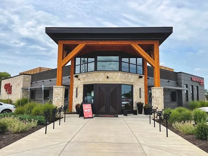 The stone and timber façade of Grindstone on the Monon stands like a welcoming beacon for hungry travelers. Rustic elegance meets Hoosier hospitality at first glance.
