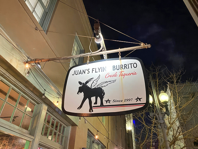 The iconic winged donkey sign beckons hungry travelers like a mythical creature promising culinary adventures. This isn't just a sign—it's a promise.