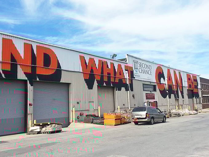 The "WHAT" painted boldly across this industrial facade isn't a question—it's your first reaction when you discover the treasures waiting inside Baltimore's ultimate salvage wonderland.