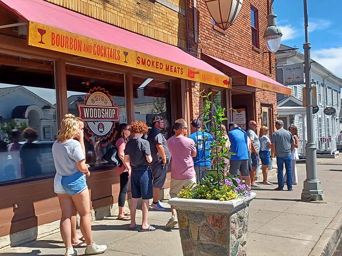 The line forms early outside Union Woodshop, where the yellow "BOURBON AND COCKTAILS" and "SMOKED MEATS" signs promise delicious things to those patient enough to wait.