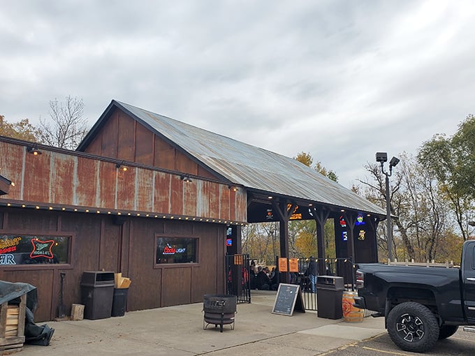 The weathered corrugated metal exterior of Big Bore Barbecue stands as a rustic beacon for meat lovers—industrial chic meets smokehouse authenticity.