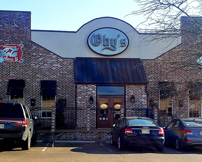 Oby's brick exterior welcomes hungry visitors with its iconic oval sign—like a beacon of sandwich salvation in Oxford's culinary landscape.