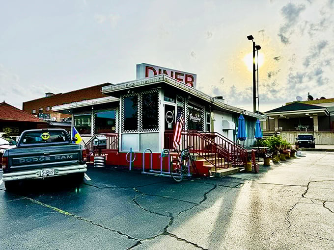 That iconic red DINER sign against the blue Missouri sky is like a beacon of breakfast hope for hungry souls. The American flag adds that perfect touch of hometown pride.