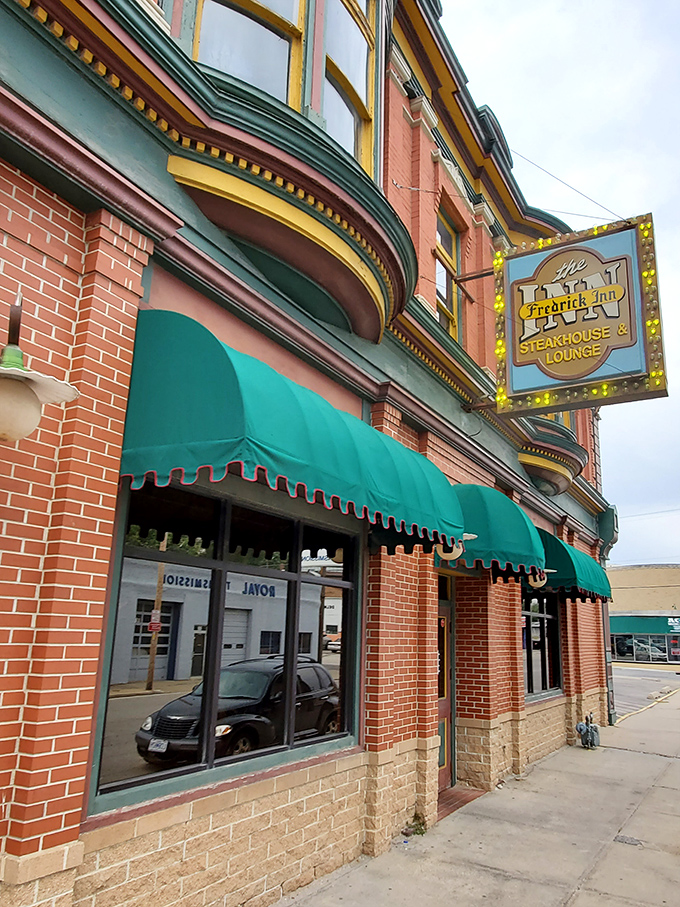 The historic brick façade with those signature green awnings isn't just inviting—it's practically a time machine to when restaurants focused on food, not fads.