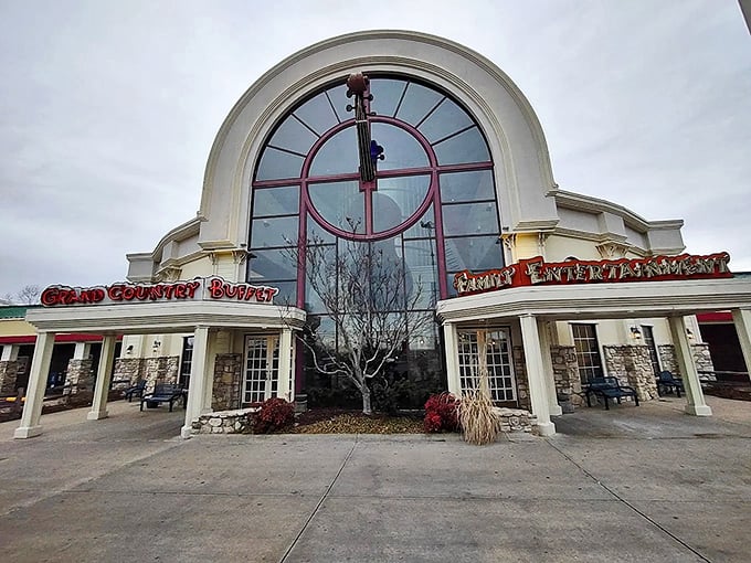The grand arched entrance to Grand Country Buffet stands like a cathedral to comfort food, beckoning hungry pilgrims with its promise of abundance.