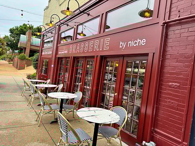 The burgundy façade with charming sidewalk seating whispers "bonjour" to Central West End passersby, promising Parisian pleasures without the passport hassle.