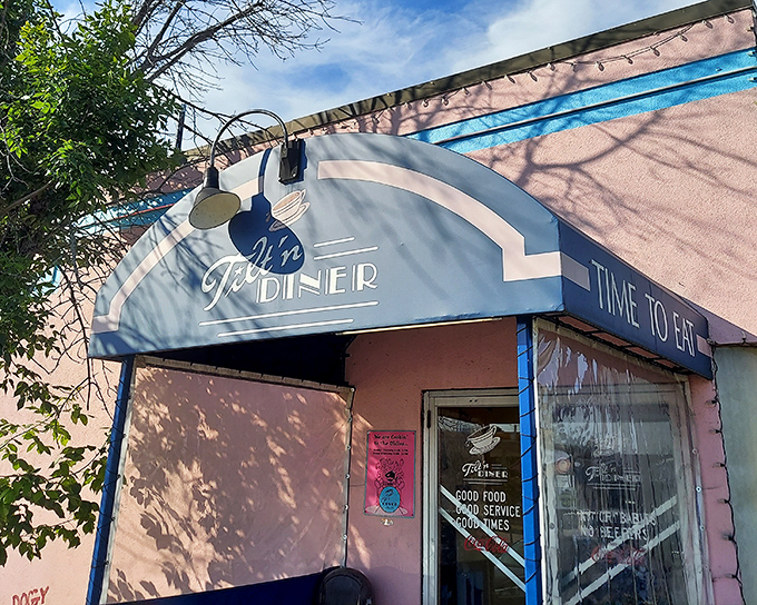 The blue-trimmed entrance of Tilt'n Diner promises exactly what we need: good food, good service, and good times—the holy trinity of diner perfection.