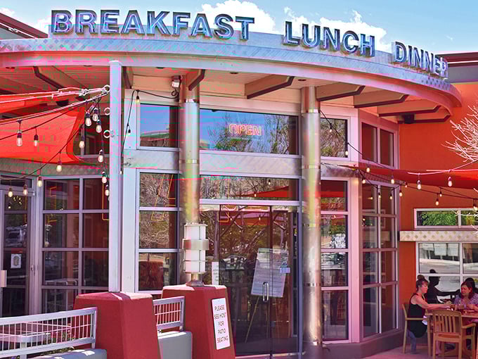 The iconic red exterior of Range Cafe beckons hungry travelers with its bold "BREAKFAST LUNCH DINNER" promise—a siren song for comfort food enthusiasts.