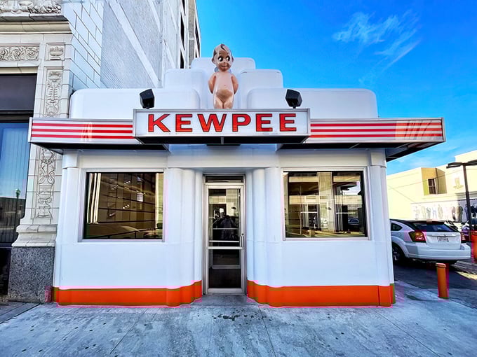 The iconic white Art Deco building with its signature Kewpee doll stands like a time capsule on Lima's streetscape, beckoning burger pilgrims from miles around.