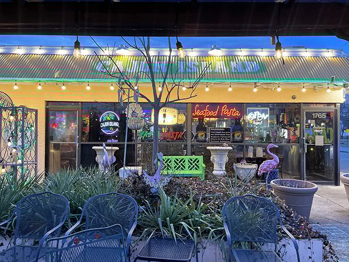 The neon "Seafood Pasta" sign glows like a culinary lighthouse, beckoning hungry travelers to this unassuming strip mall treasure in Reynoldsburg.