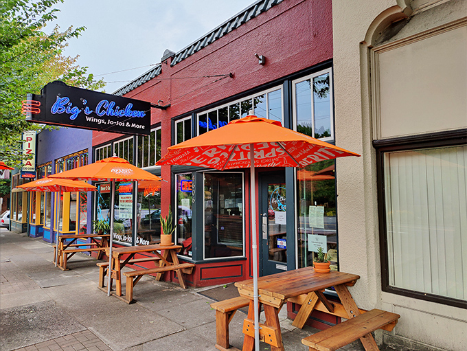 The bright red exterior of Big's Chicken with its cheerful orange umbrellas stands like a beacon of hope for the hungry traveler. Portland's culinary treasures often hide in plain sight.